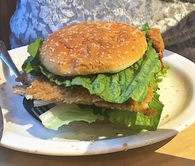The tenderloin sandwich in its more modest form – though "modest" is relative when the meat still eclipses the bun.