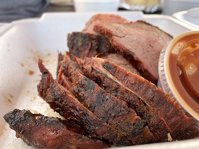 Tri-tip sliced to perfection reveals that magical gradient from bark to pink—a textbook example of why patience is a pitmaster's virtue.