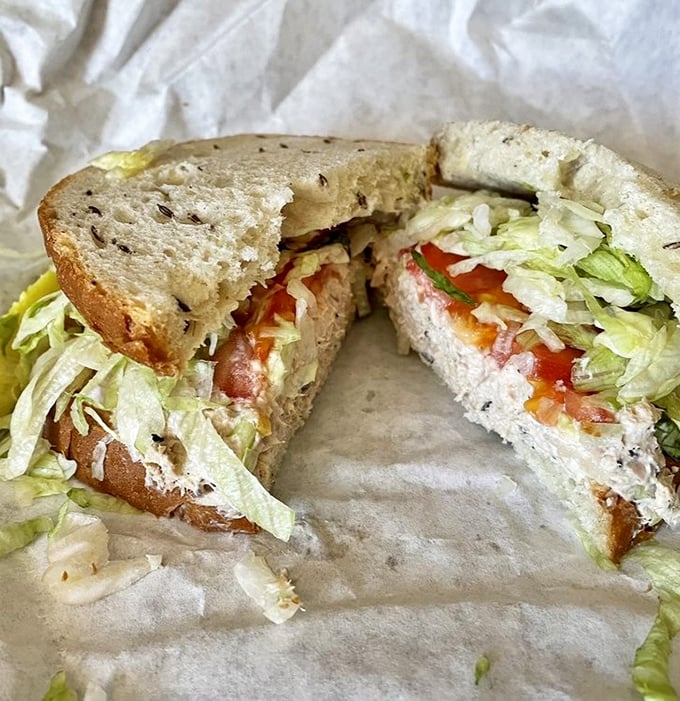 This isn't your sad office lunch tuna sandwich—it's a proper deli creation with crisp lettuce and tomato on bread that actually has flavor.