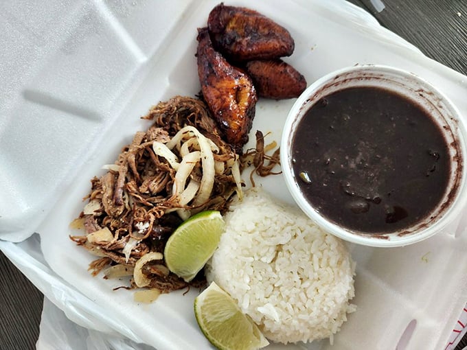 Vaca frita with black beans and plantains—a plate that proves heaven isn't a place, but rather a perfectly executed Cuban classic.