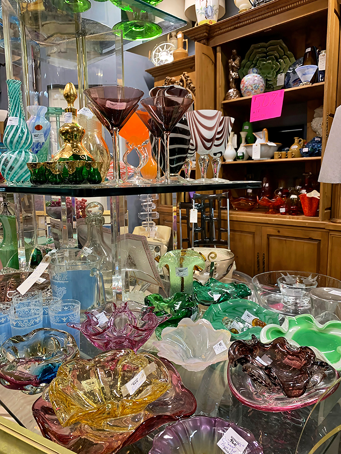 A rainbow of vintage glassware catches light like liquid jewels. These aren't just drinking vessels—they're conversation pieces for your next dinner party.