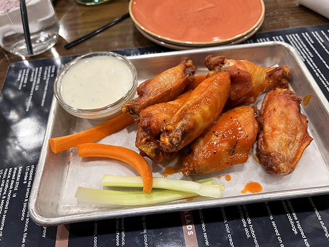 Wings that have achieved that mythical balance—crispy exterior, juicy interior, and a sauce that should be bottled and sold as liquid gold.