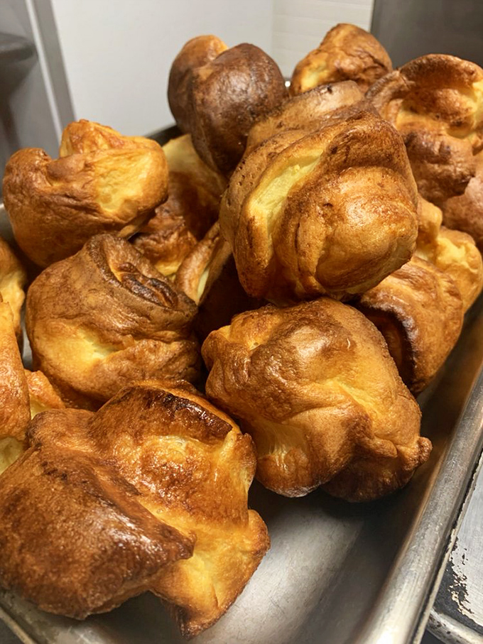 Yorkshire puddings puffed to golden perfection – these cloud-like treasures are ready to cradle gravy like nature intended.