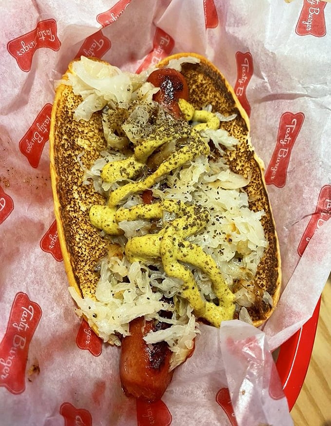 The hot dog that refuses to be overshadowed by its burger brethren. Dressed with sauerkraut and mustard, it's a reminder of simple pleasures done right.