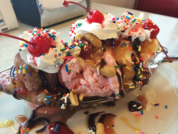 This isn't just a banana split—it's a carnival of ice cream, toppings, whipped cream, and cherries that makes adults remember why being a kid was so great.