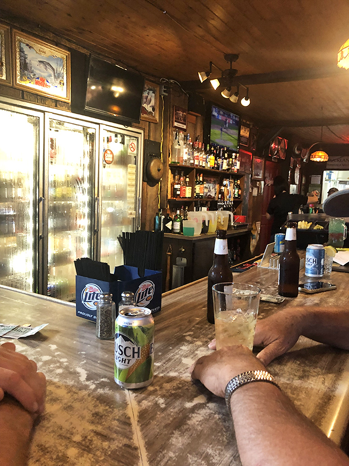 The bar area—where strangers become friends over cold beers and hot takes about everything from local sports to global politics. 