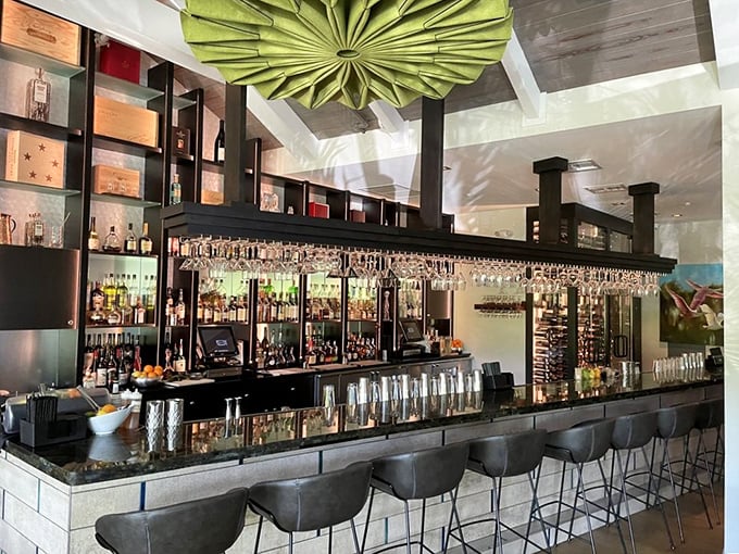A bar that understands the importance of proper glassware hanging like crystal stalactites, ready for your libation of choice.