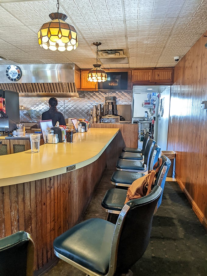 The counter view: where anticipation builds as you watch your burger being prepared. Like theater, but with better refreshments.