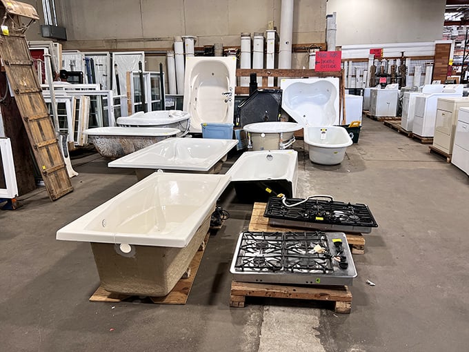 Bathtub boulevard showcases pristine porcelain treasures alongside modern cooktops—because someone's dream kitchen and bathroom are waiting to be discovered.