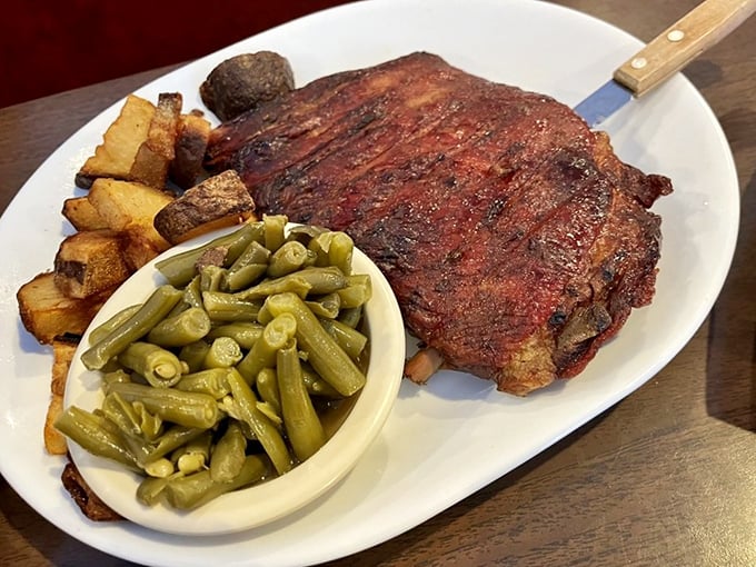 These ribs don't need a filter—that bark, that smoke ring, those perfectly cooked green beans. A plate of pure Southern poetry.