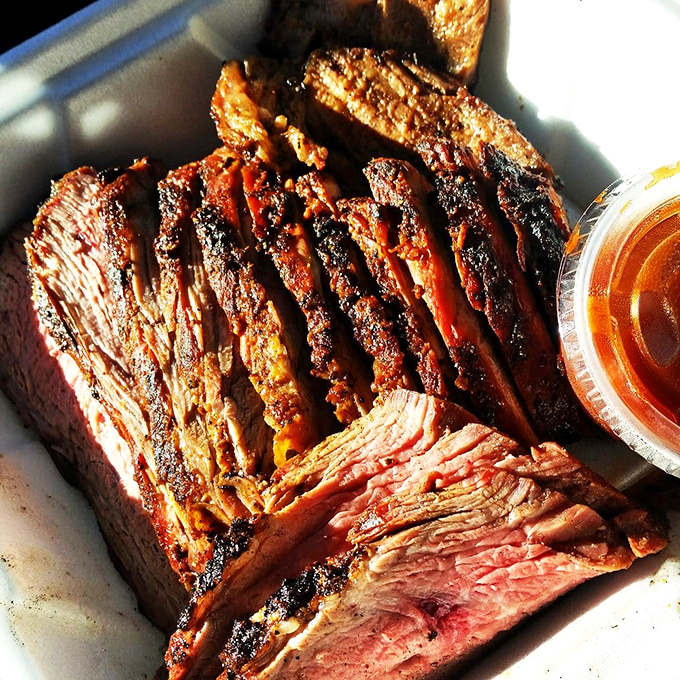 Tri-tip sliced against the grain reveals that perfect pink center—the barbecue equivalent of finding gold in these California hills.