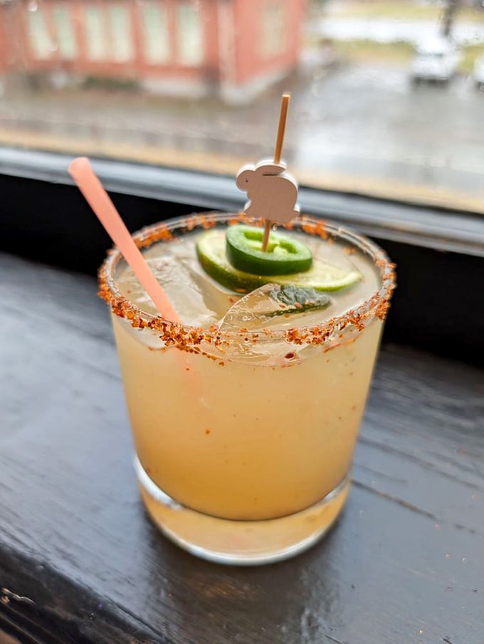 This isn't just a margarita; it's liquid sunshine with a spicy rim and adorable rabbit garnish that says "we take fun seriously here."