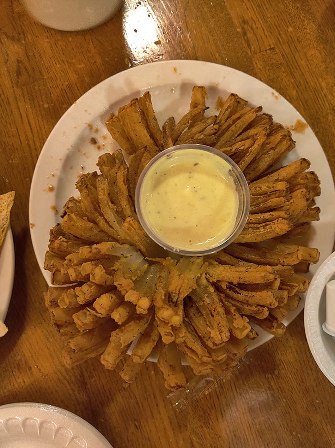 The blooming onion—a flower that blooms not in spring but in hot oil, creating a crispy, petal-like experience that's impossible to stop eating. 
