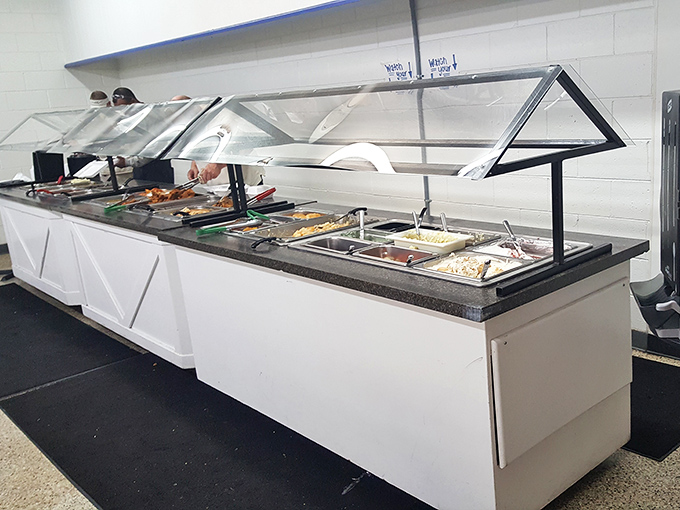 The buffet line gleams with possibility – each metal tray a doorway to comfort food nirvana. Choose wisely, but remember: second trips are encouraged.