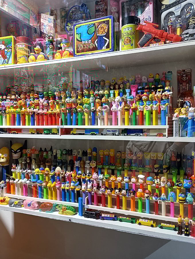 PEZ paradise! This kaleidoscope of candy dispensers showcases pop culture's sweetest collectibles, from superheroes to cartoon characters, all in perfect formation.