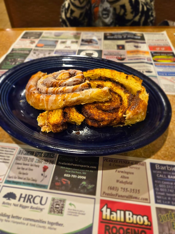 A cinnamon roll that's clearly living its best life—spiraled to perfection and glazed with what can only be described as breakfast frosting.