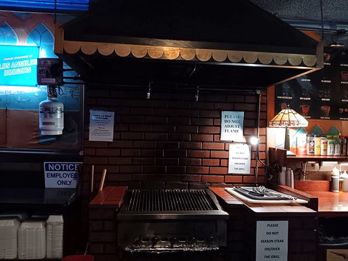 The legendary grill station – hallowed ground where strangers become comrades in the noble pursuit of perfect char marks and medium-rare perfection.