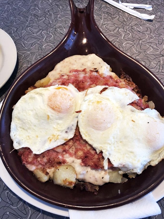 Corned beef hash with sunny-side-up eggs—a skillet symphony where every bite hits that perfect balance between crispy and tender.