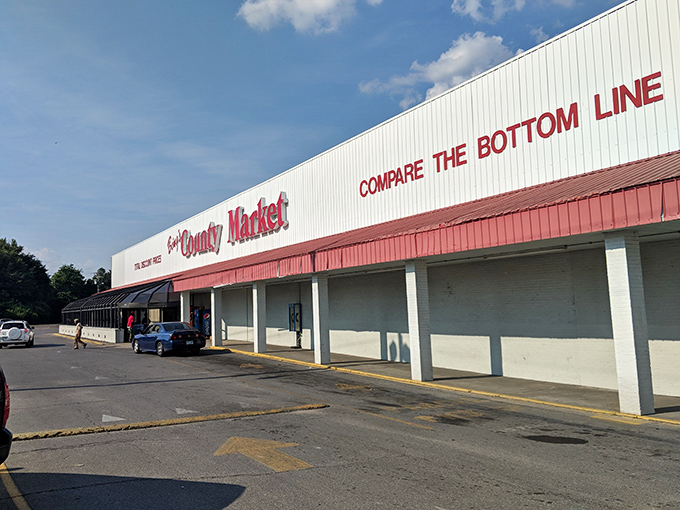 Sun County Market's "Compare the Bottom Line" sign perfectly captures Delta practicality – good value never goes out of style in Greenville.