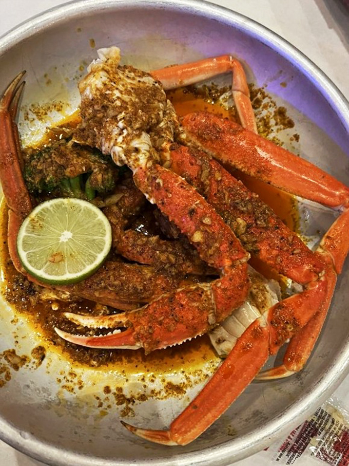 Crab legs bathed in spices and butter—nature's way of saying you deserve something that requires effort but rewards magnificently.