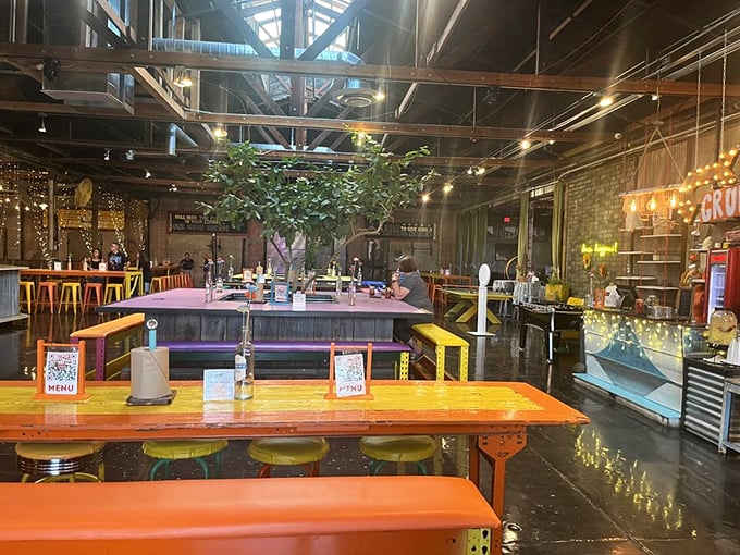 Colorful tables, industrial ceiling, and that unmistakable tree growing indoors—The Duce's dining area feels like the coolest community gathering spot in town.