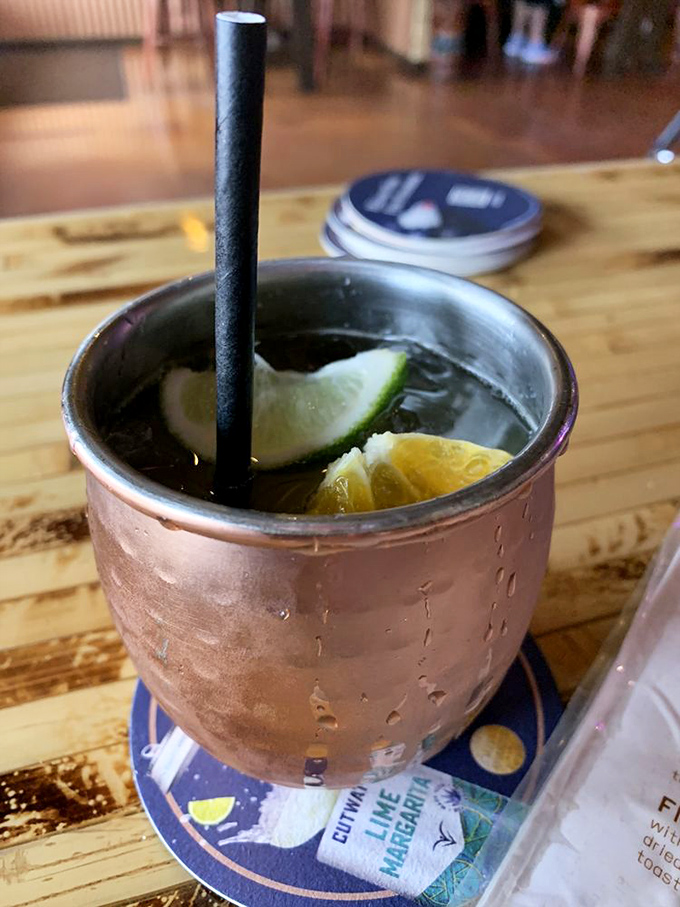 This copper mug doesn't just hold a cocktail—it cradles a masterpiece of lime, spirits, and the promise of a perfect evening.