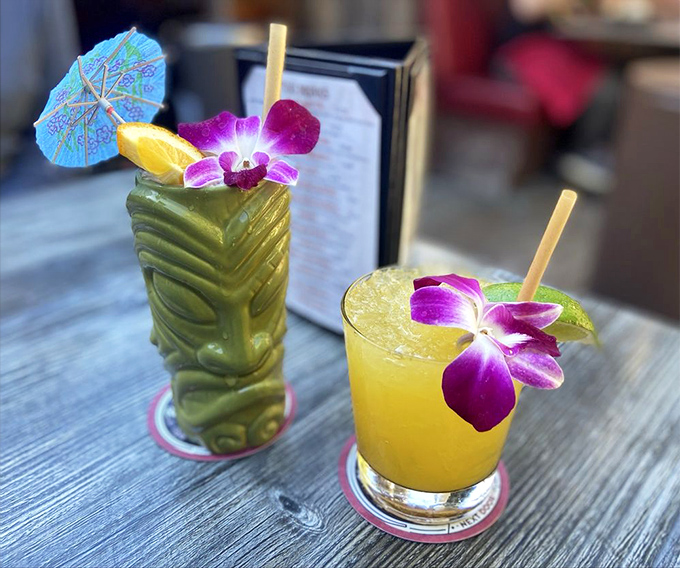 Tiki drinks that transport you to island time with one sip. The ceramic mug isn't just a vessel—it's part of the tropical escape package.