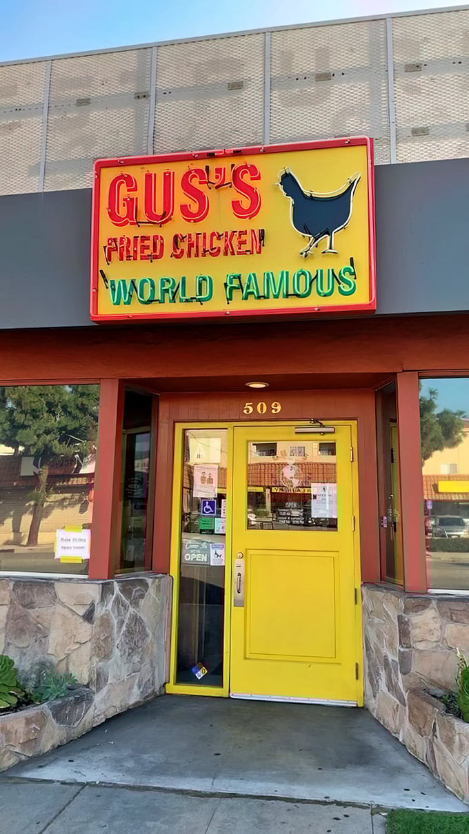 That yellow door is like a portal to a better world—one where crispy chicken skin crackles between your teeth and worries temporarily disappear.