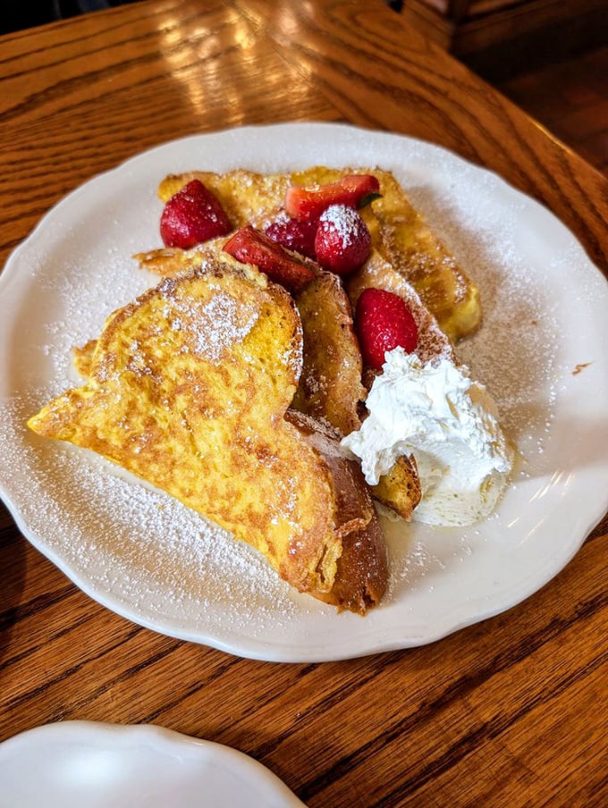 French toast that makes you want to stand up and salute—crisp edges, custardy centers, and fresh strawberries playing supporting roles.