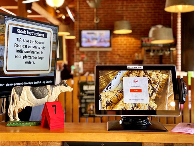 Modern efficiency meets old-school barbecue—the digital ordering kiosk stands ready, though nothing about the food is remotely automated.