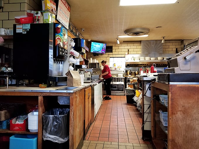 The kitchen where the magic happens – no fancy equipment, just well-seasoned cookware and decades of know-how. Some of the best meals come from the simplest kitchens.