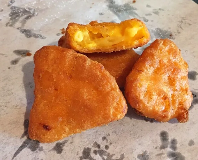 Mac and cheese bites—childhood comfort food all grown up and ready to party. Crispy outside, creamy inside.