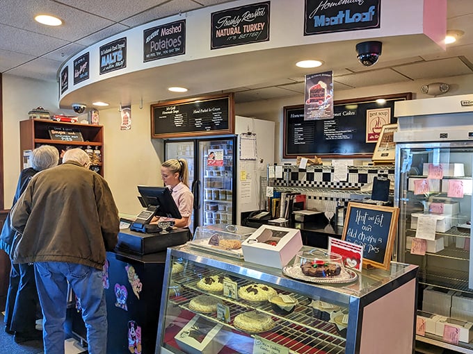 The counter where magic happens. Those signs aren't just decoration—they're badges of honor earned through decades of perfecting comfort classics.