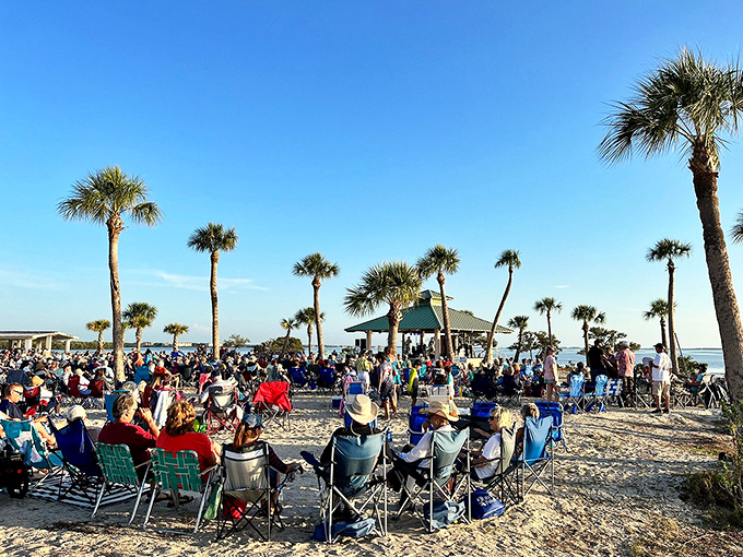 The beach transforms into Florida's most exclusive concert venue. No ticket scalpers, no bad seats, just community gathering to celebrate day's end.