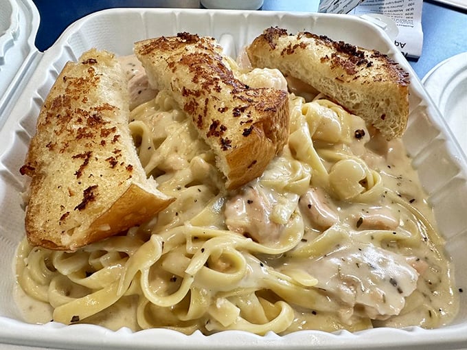 Creamy seafood pasta that doesn't apologize for its richness—comfort food that's had a promotion and now vacations on the coast.
