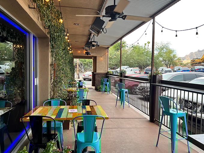 Arizona evenings were made for patios like this. Those turquoise chairs practically whisper "stay for one more round."