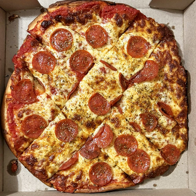 Even the pizza gets the Speedway treatment – a perfectly circular tribute to Indiana's love affair with things that go round and round.