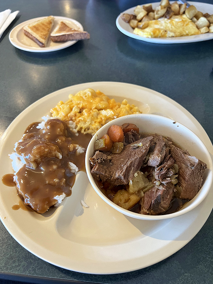 Sunday dinner any day of the week—tender pot roast with vegetables and gravy-soaked rice plus eggs that didn't need to be there but showed up anyway.