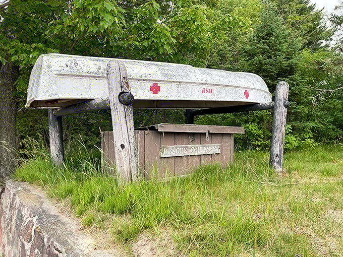 An overturned boat serves as rustic shelter for park equipment—Upper Peninsula ingenuity at its finest.