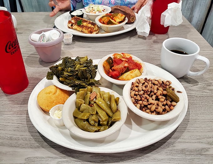 The true test of a Southern restaurant isn't just its main dishes but its sides—collards, field peas, and cornbread that could stand alone as meals.