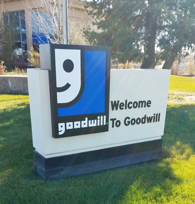 The smiling logo says it all—doing good while scoring great deals. Thrift karma is real, and it starts right here.