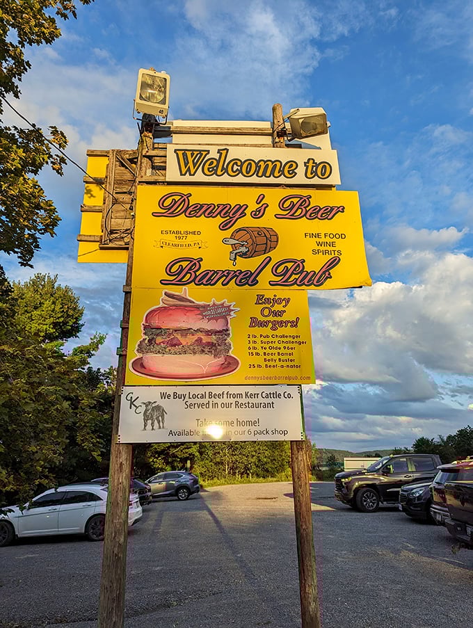This sign isn't just giving directions—it's issuing a challenge to hungry travelers with its siren call of legendary burgers.