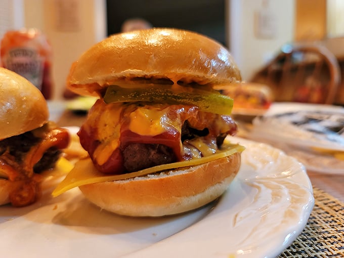 This isn't just a burger—it's a masterpiece of comfort food engineering. The pickle adds that perfect tangy counterpoint to all that richness.