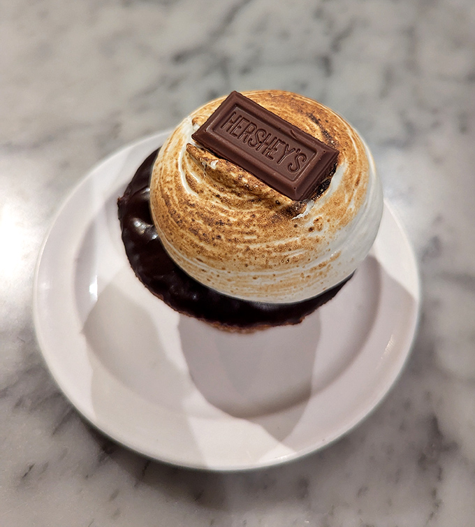 This s'mores cupcake doesn't just reference campfire classics—it improves upon them with a perfectly toasted marshmallow crown and Hershey's chocolate hat.