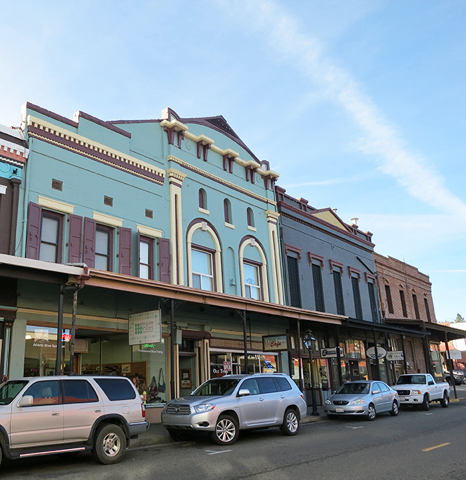 Colorful storefronts line historic streets where shopping becomes a delightful journey through time and taste.