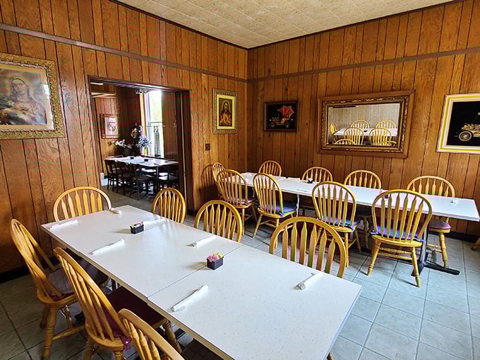 Wooden chairs and white tablecloths create an unpretentious dining space where the food, not the decor, rightfully takes center stage.