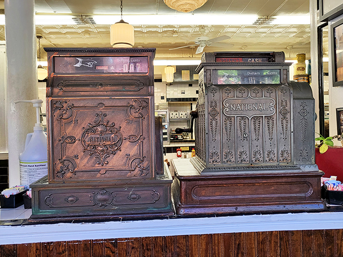 These antique cash registers have witnessed decades of satisfied customers—silent sentinels to countless "I couldn't possibly eat another bite" declarations.