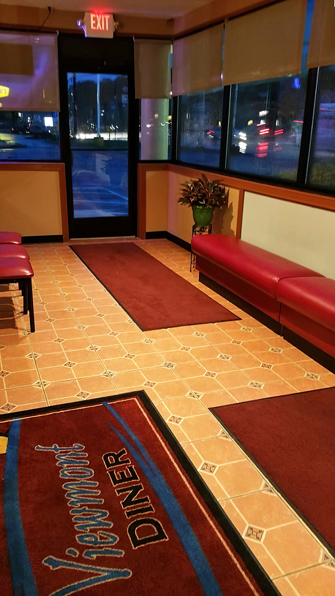 The entrance area isn't just functional—it's the threshold between ordinary life and diner magic. That custom floor mat welcomes you to the comfort zone. 