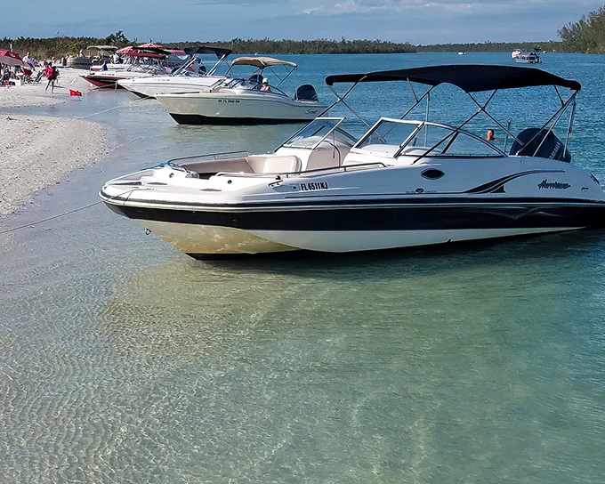 Keewaydin Island: where boats become temporary neighbors in a floating community. The commute to this beach requires a captain's license!