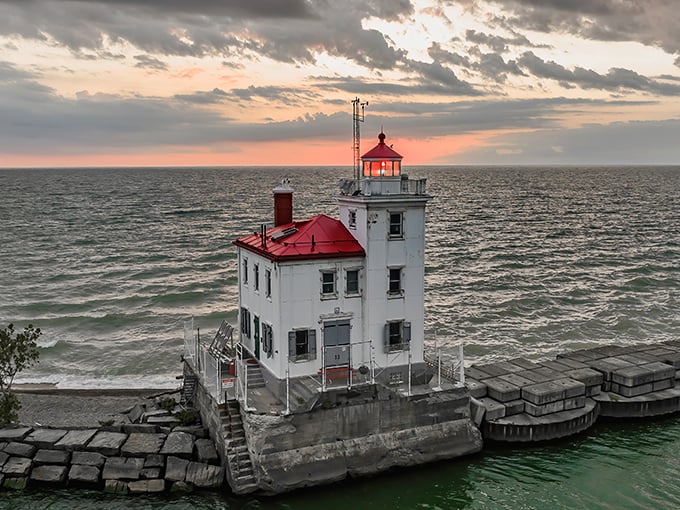 Sunset transforms the white lighthouse into a glowing ember on Lake Erie's edge—proof that Mother Nature is still the best lighting designer.